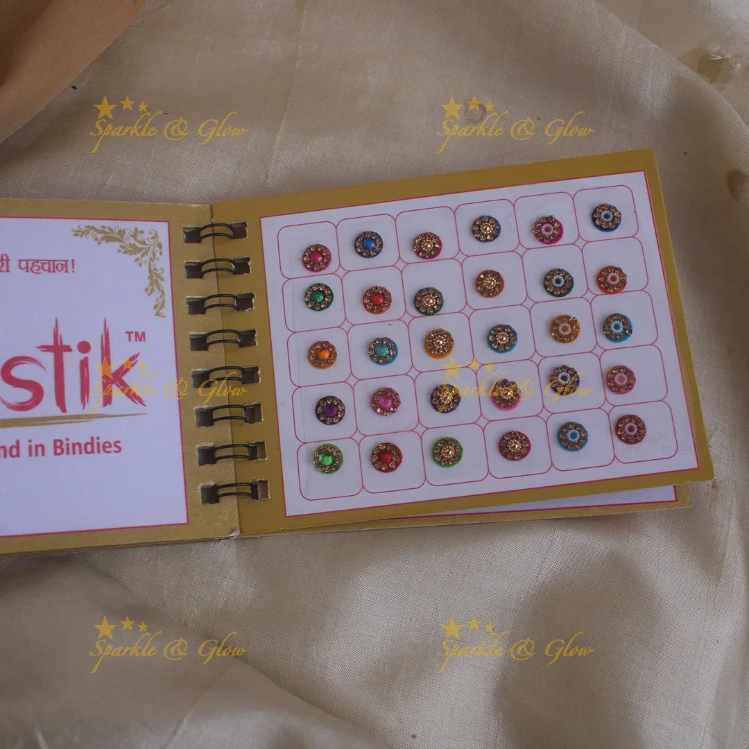 Swastik round stone and gold design bindi with single size in spiral b ...